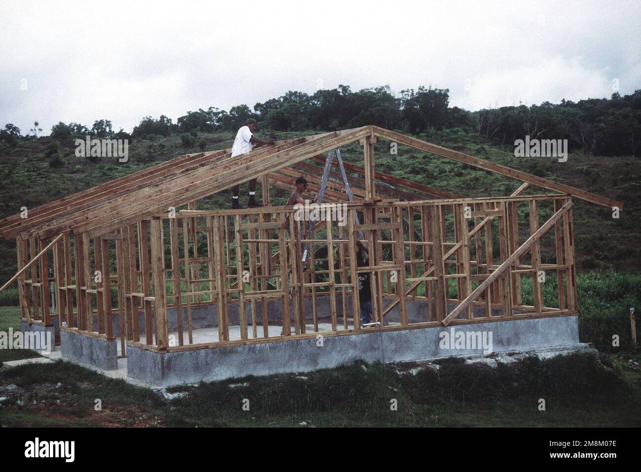 SENIOR CHIEF Builder (BUCS) Jeffrey Gilbert assist his shipmates as ...