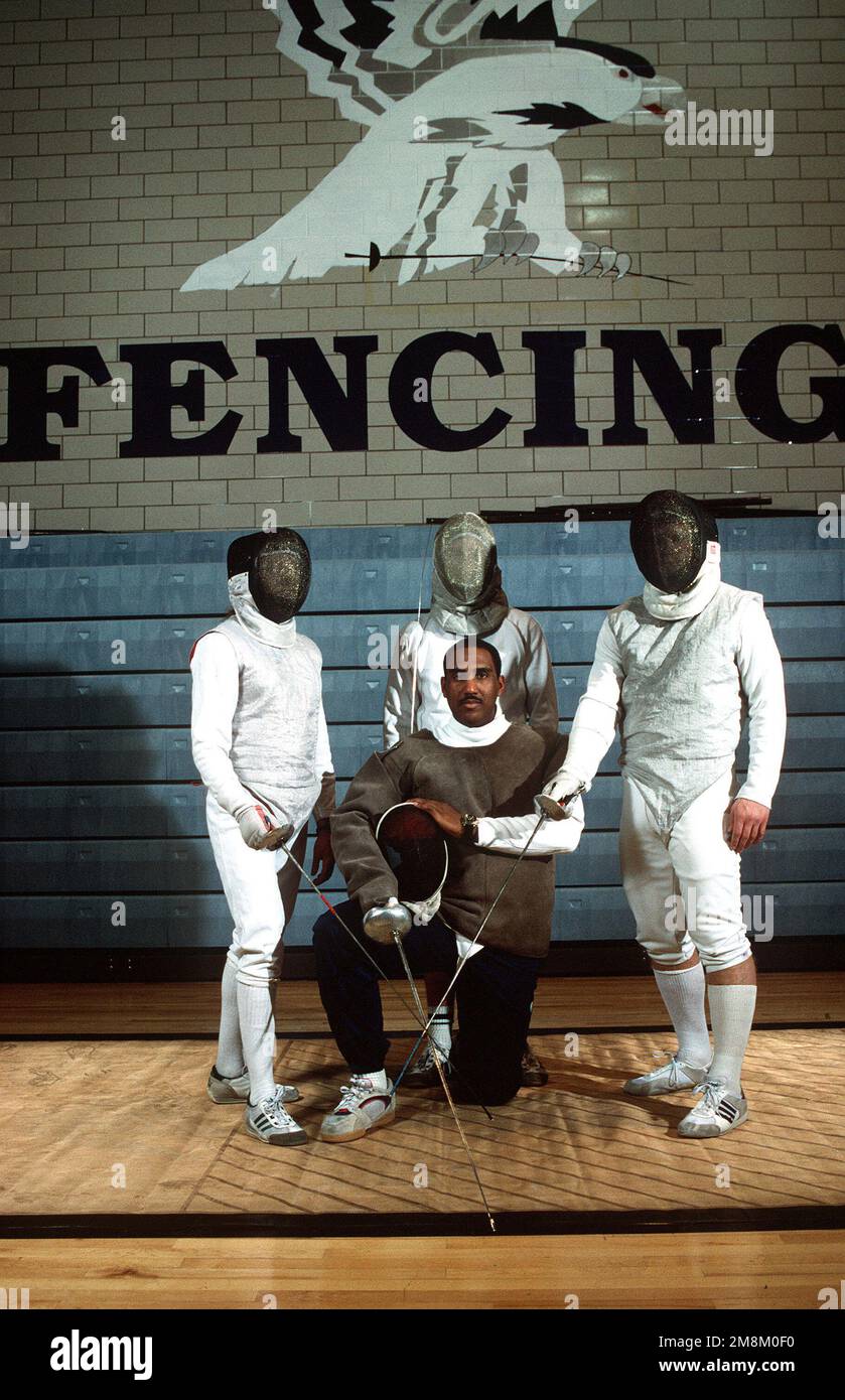 CAPT. Stewart LeBlanc poses with three of the cadets who he coaches in ...
