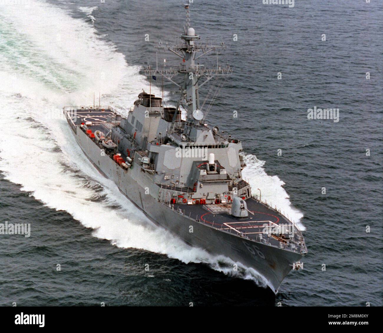 An aerial starboard bow view of the guided missile destroyer USS ...