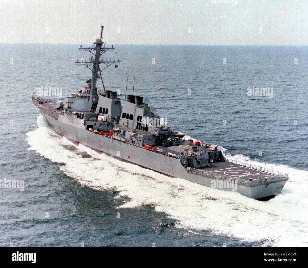A low oblique port quarter view of the guided missile destroyer USS ...