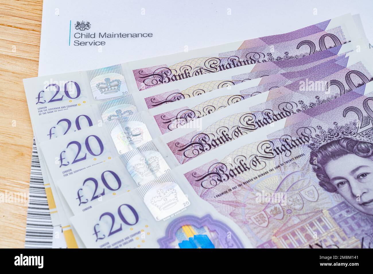 Child Maintenance service document with banknotes - UK Stock Photo - Alamy