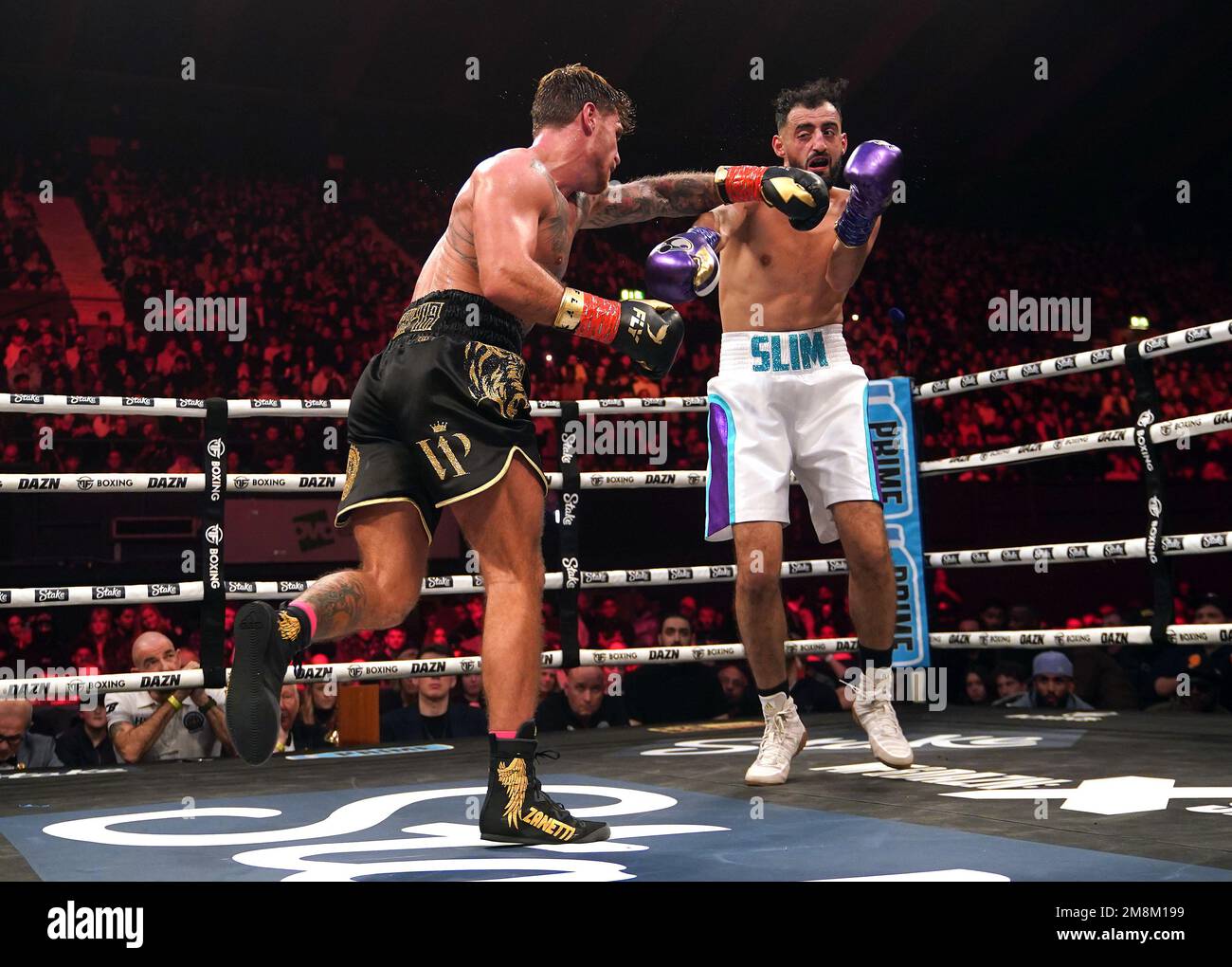 Tom Zanetti (left) in action against Slim Albaher in the light ...