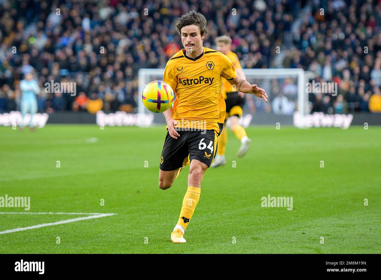 Hugo Bueno #64 of Wolverhampton Wanderers with the ball during the ...