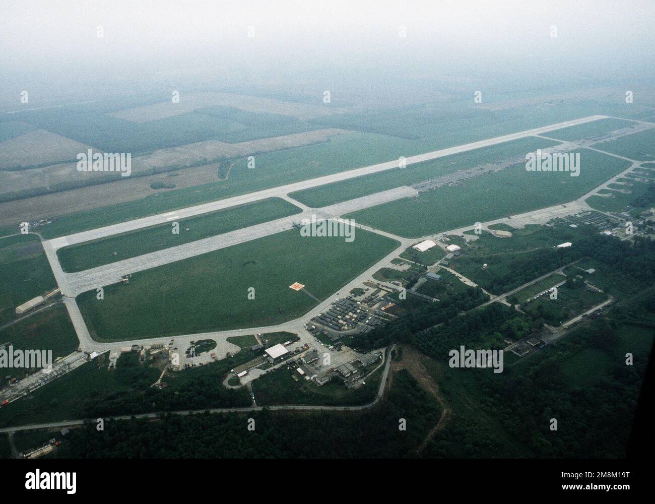 Aerial view of the north side of the airfield and aircraft ramp at the Taszar Air Base in ...