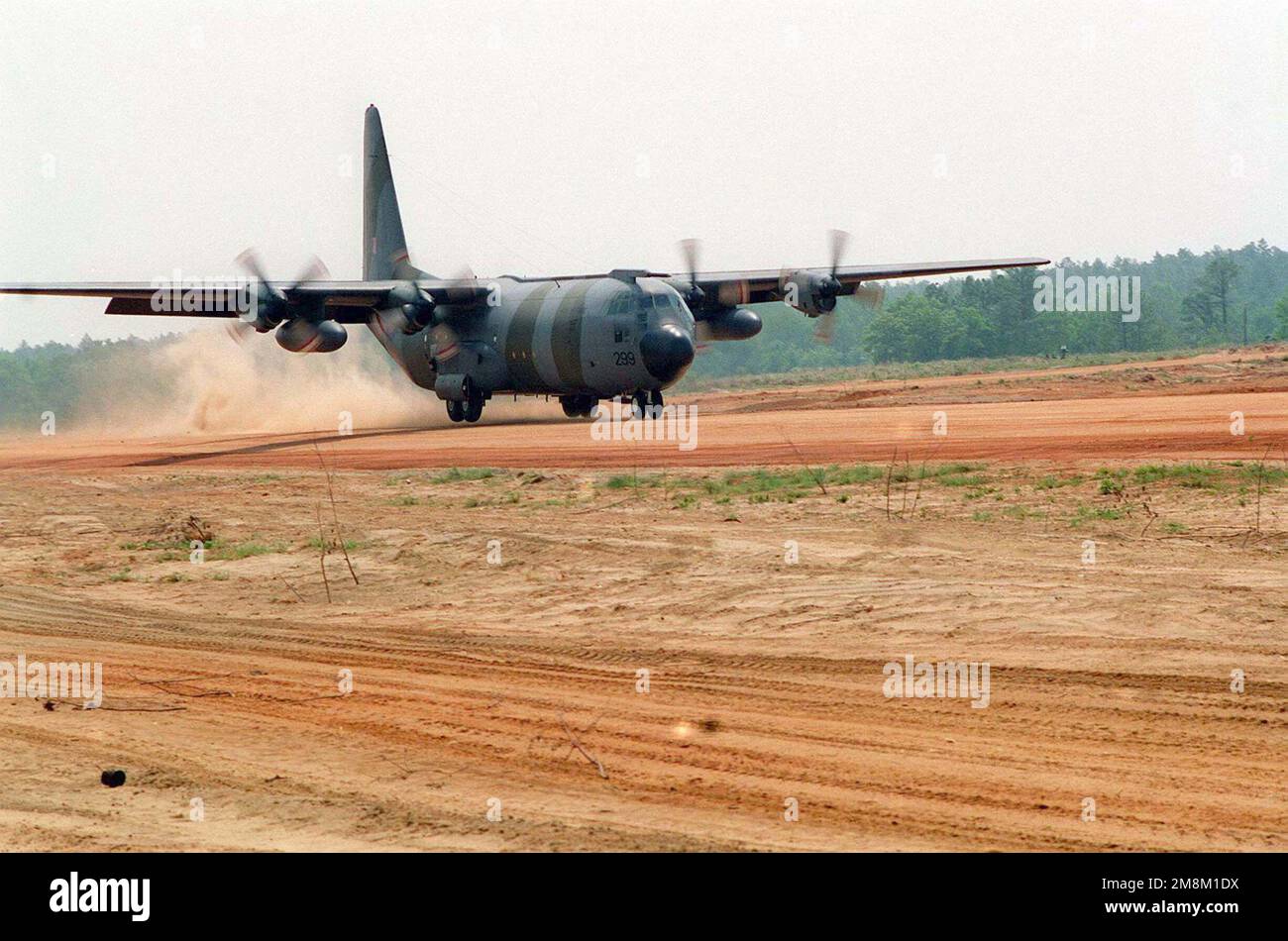 A British Royal Air Force Hercules C-130 lands at Drop Zone Luzon near ...