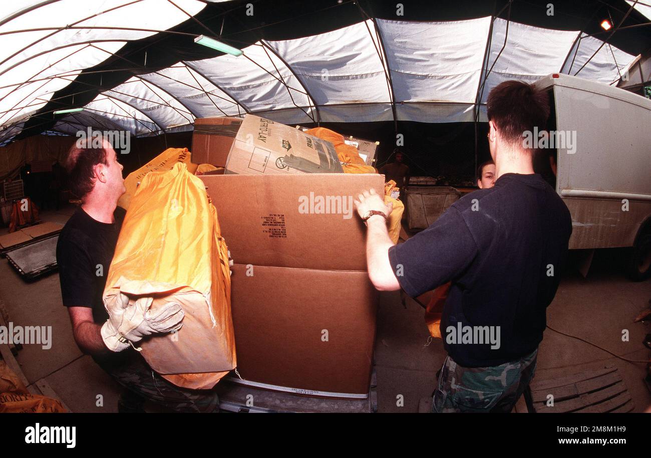 A1C Galen Rowlett (left), a Mail Control Activity Agent from detechment ...