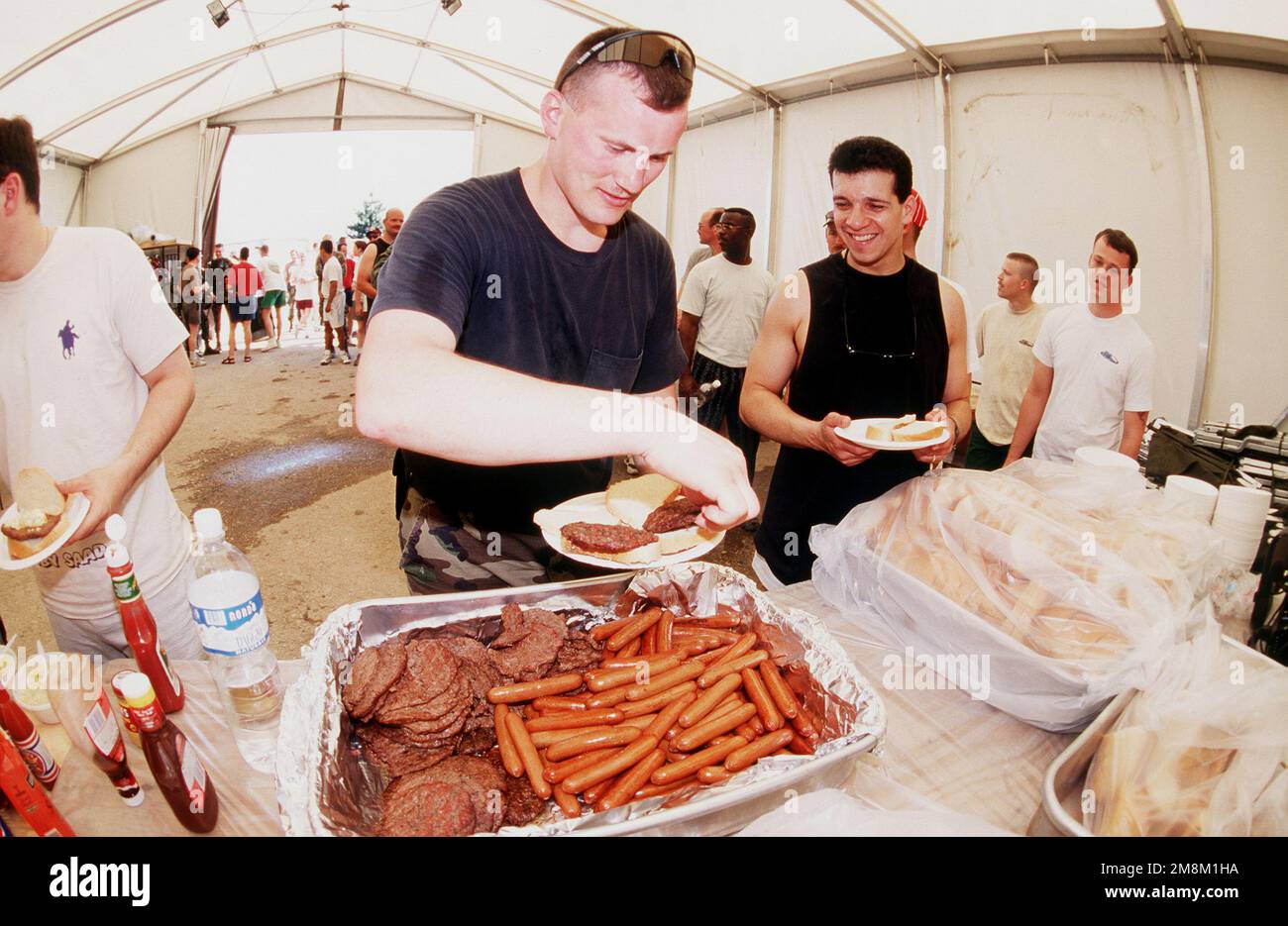 Inside the food tent an Air Force member of the 4100th Operations ...