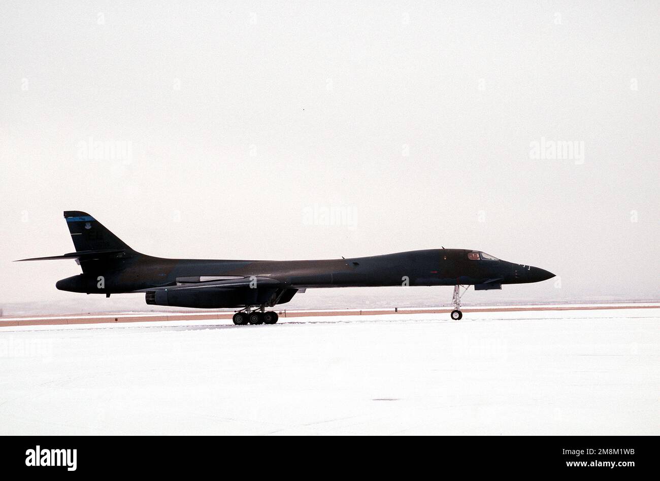 Left side view of a B-1B Lancer resting on the runway. Base: Ellsworth ...
