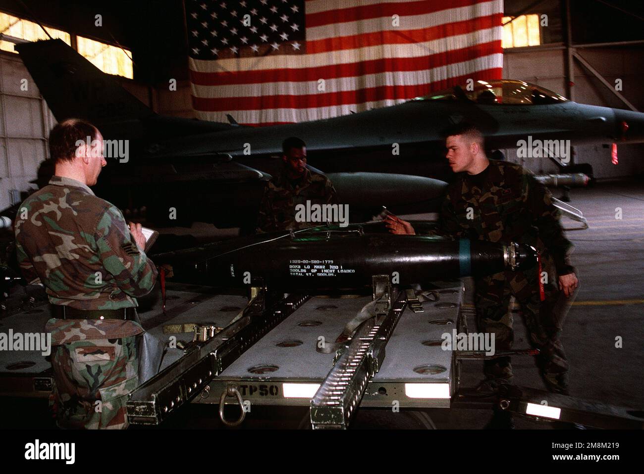 Personnel from 35th Fighter Weapons Squadron, prepare a bomb loader to ...
