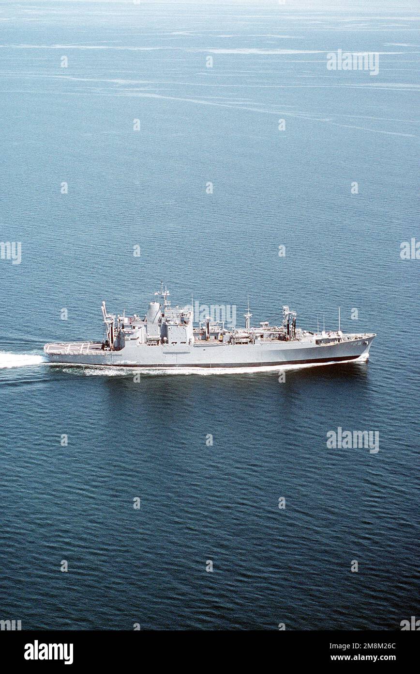 Aerial starboard beam view of the Military Sealift Command (MSC) ammunition ship USNS MOUNT HOOD ...