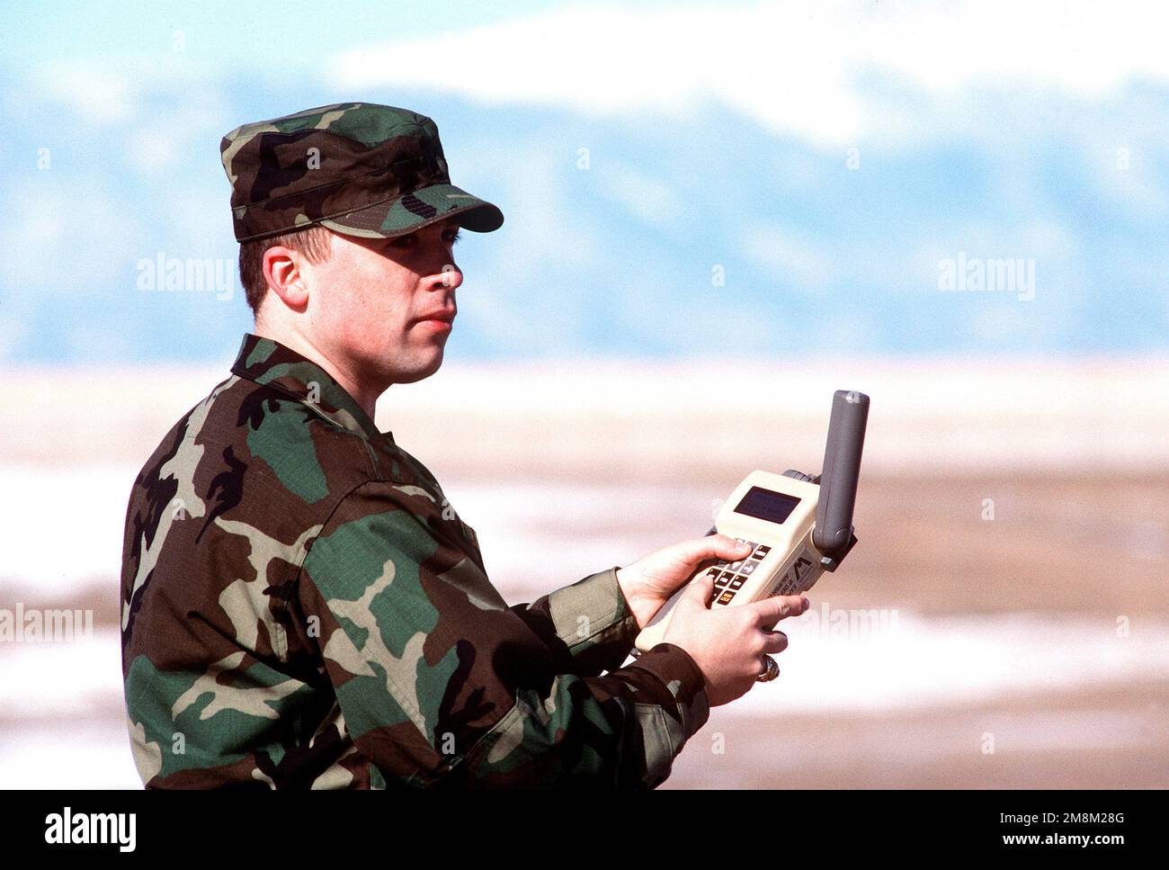 1ST LT. Mark D. Lester tests a hand-held Global Positioning System ...