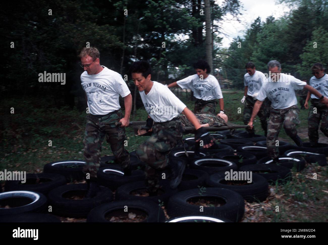 Team Nevada (152nd Airlift Wing, Reno, Nev.), litter carry a "victim ...