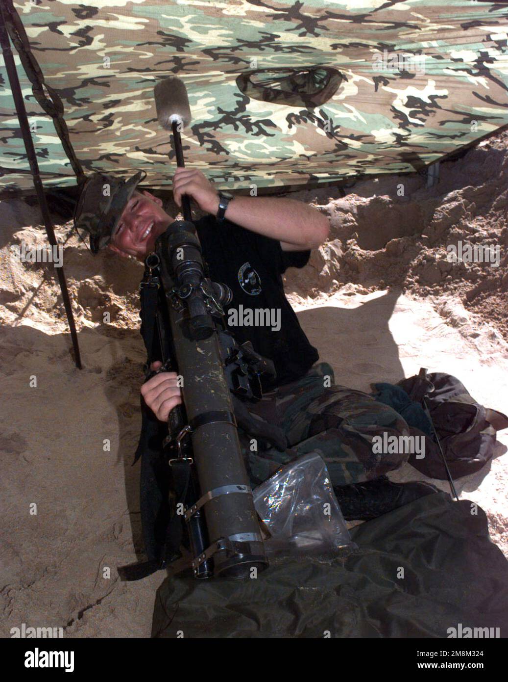 US Marine Corps Private First Class Brian Feldhiser leans an anti-tank ...
