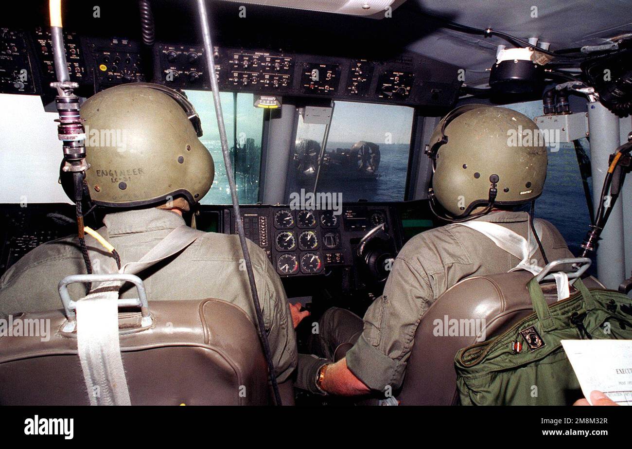An all-enlisted crew pilots a Landing Craft Air Cushion (LCAC) to the ...