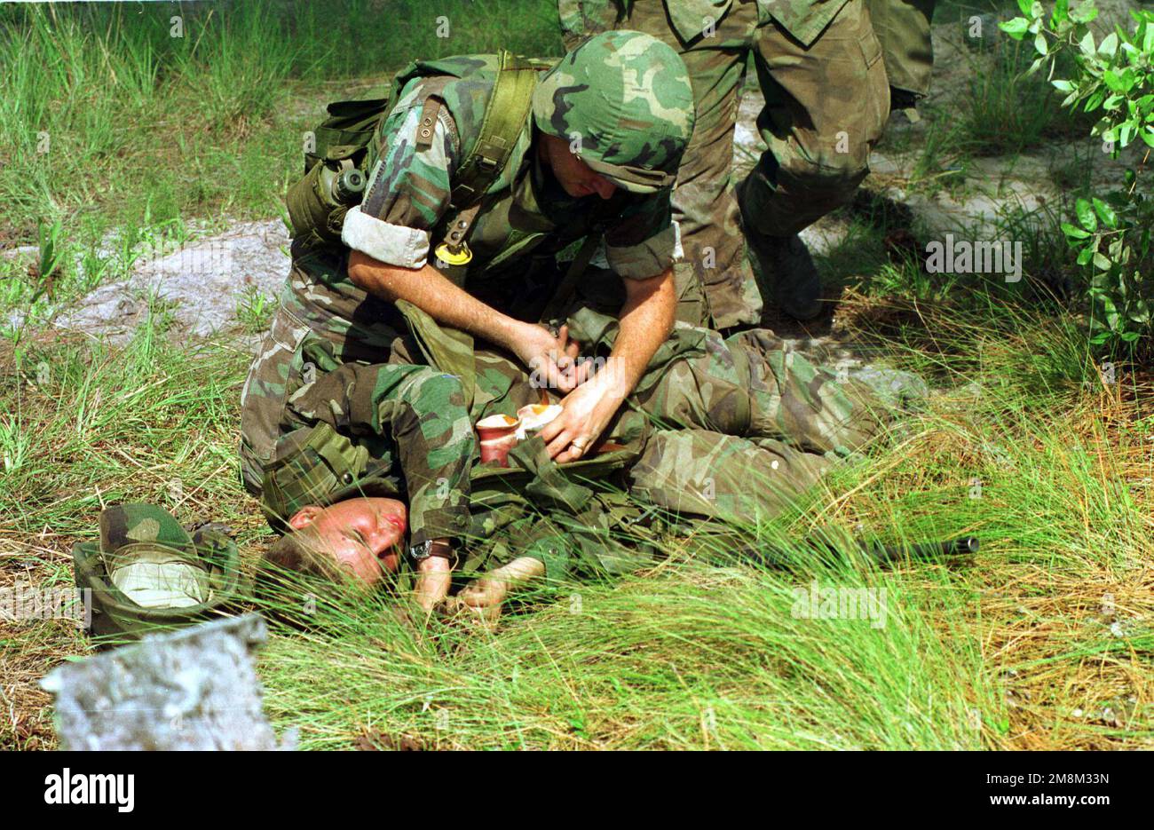 A Marine from Headquarters and Service Company, checks the status of an ...