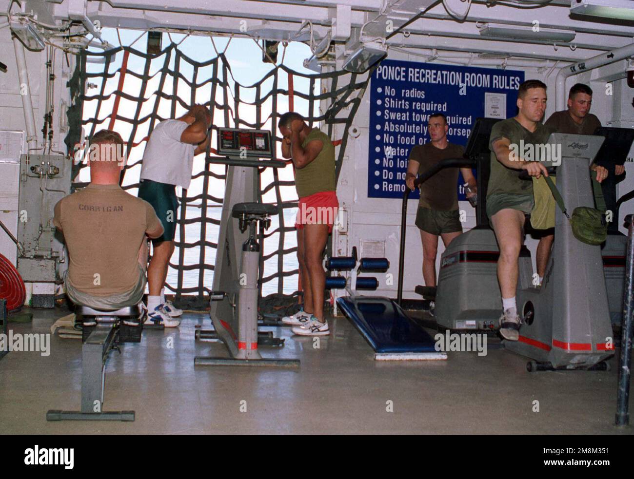 Marines from 3rd Battalion, 8th Marine Regiment use the gym facilities ...