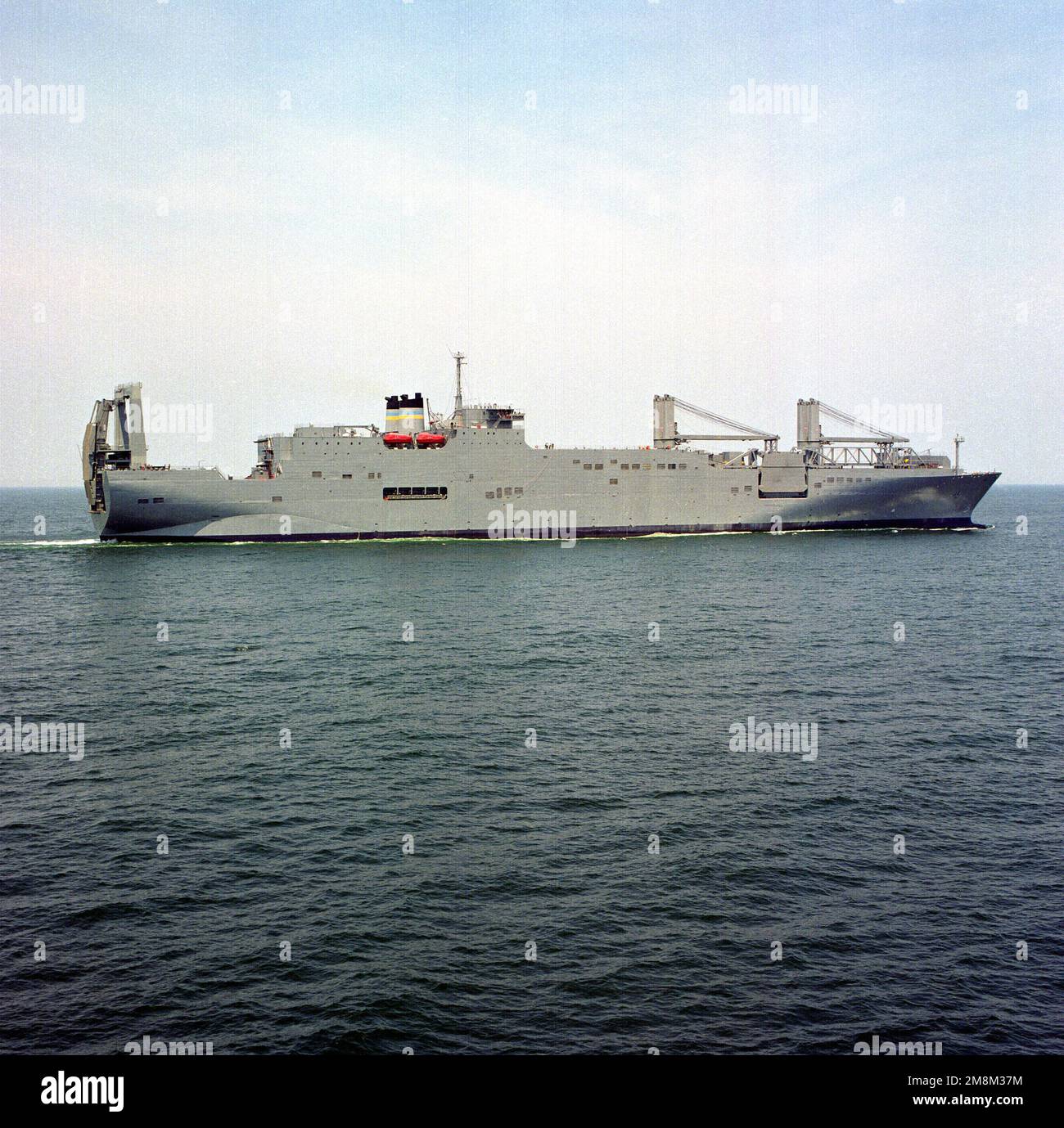 An aerial starboard side view of the Military Sealift Command (MSC) vehicle transport ship USNS ...