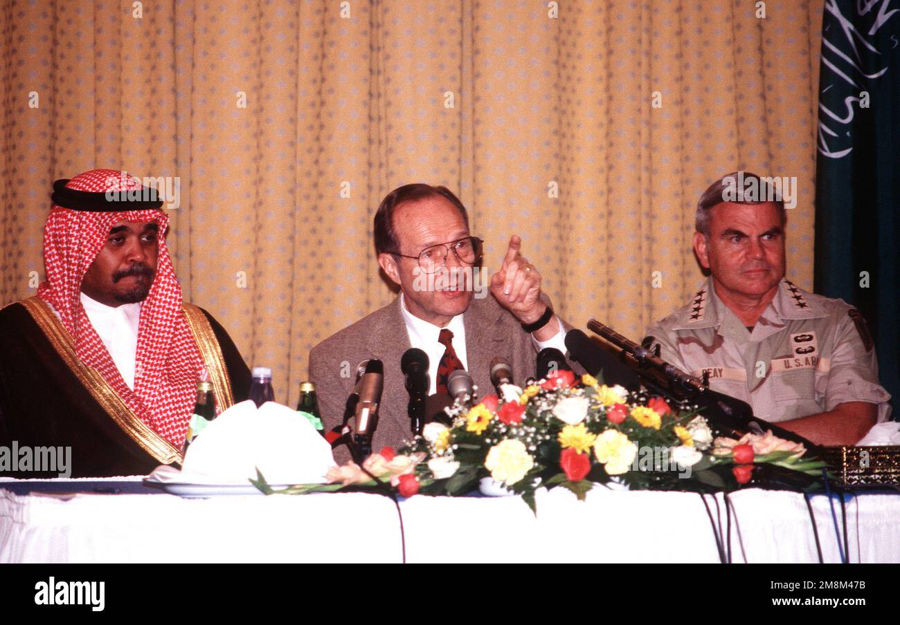 U.S. Secretary of Defense William J. Perry (center) emphasizes a point ...