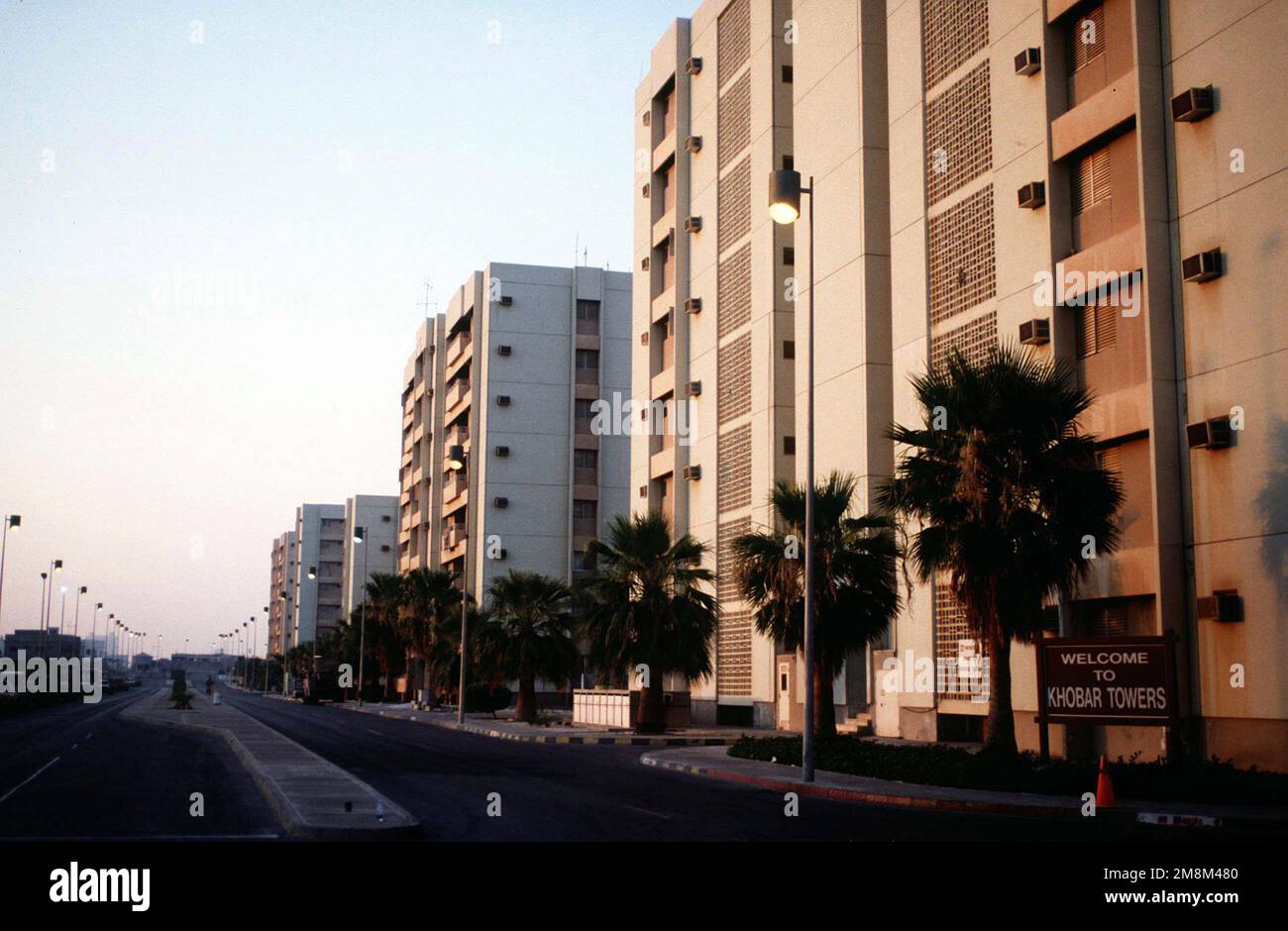 A photograph of the entrance of the Khobar Towers which was the site of ...
