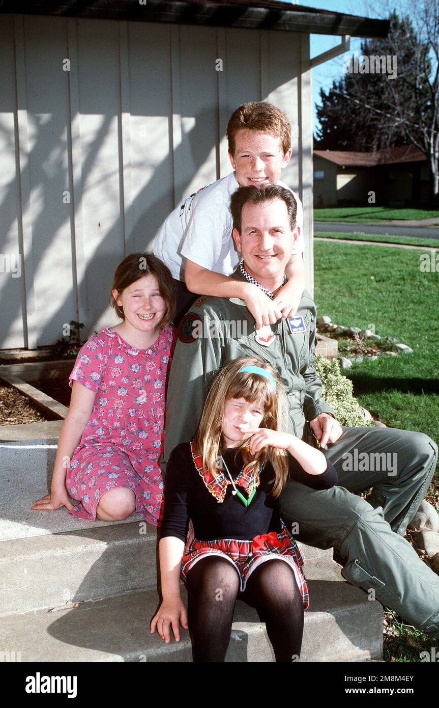 MAJ. David Smith poses outside his home with his three children, Damien ...