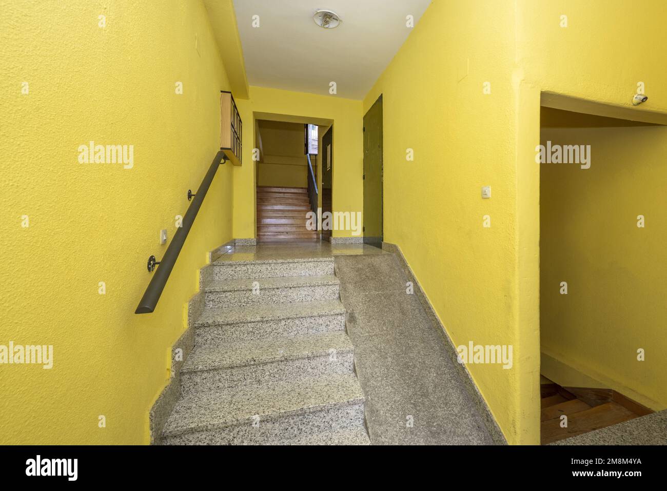 Gray granite stairs of a house with an unusable ramp due to its ...