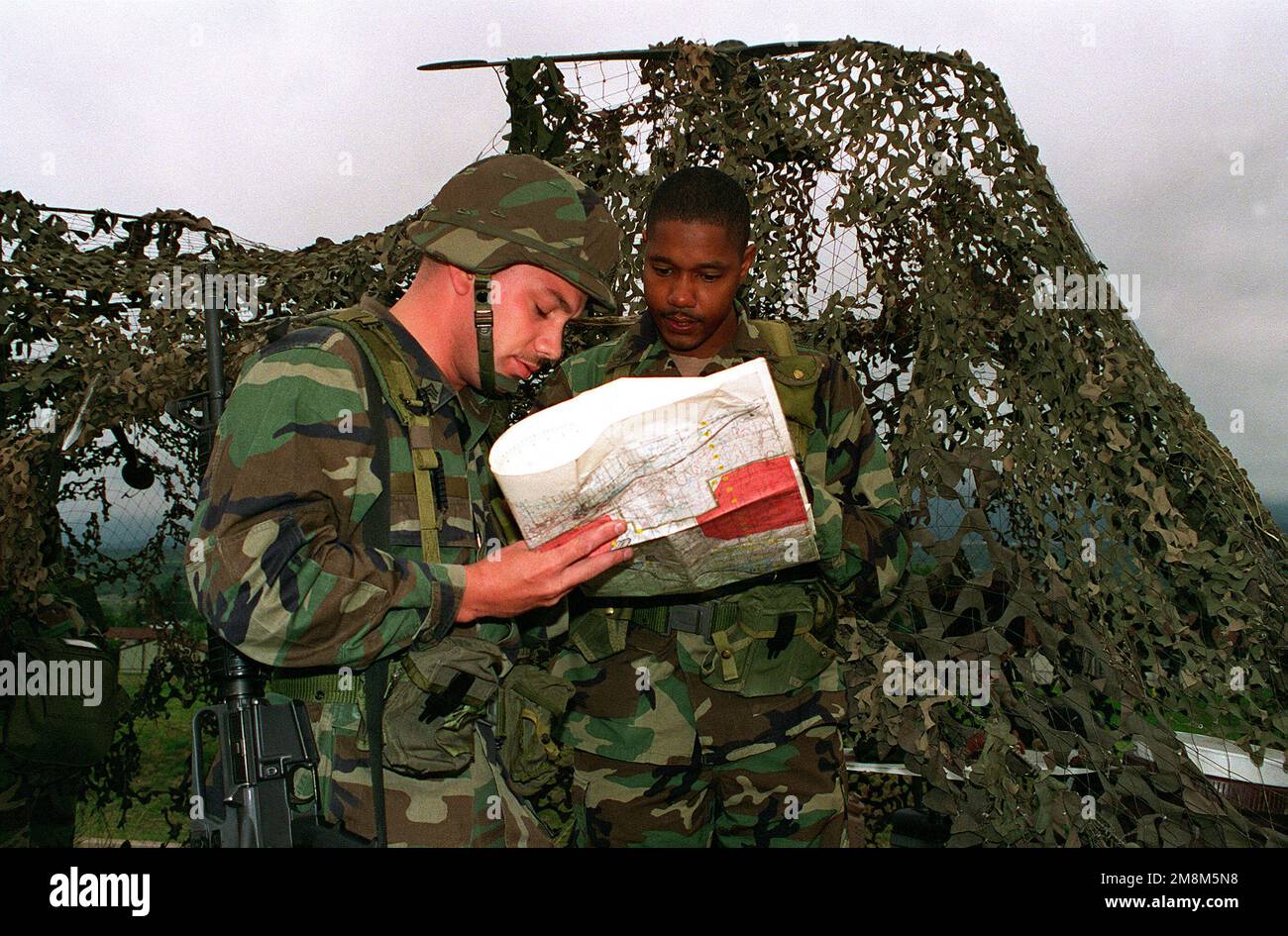SGT. Kenneth P. Wise, 52nd Engineers, is given a standard 1:50,000 ...