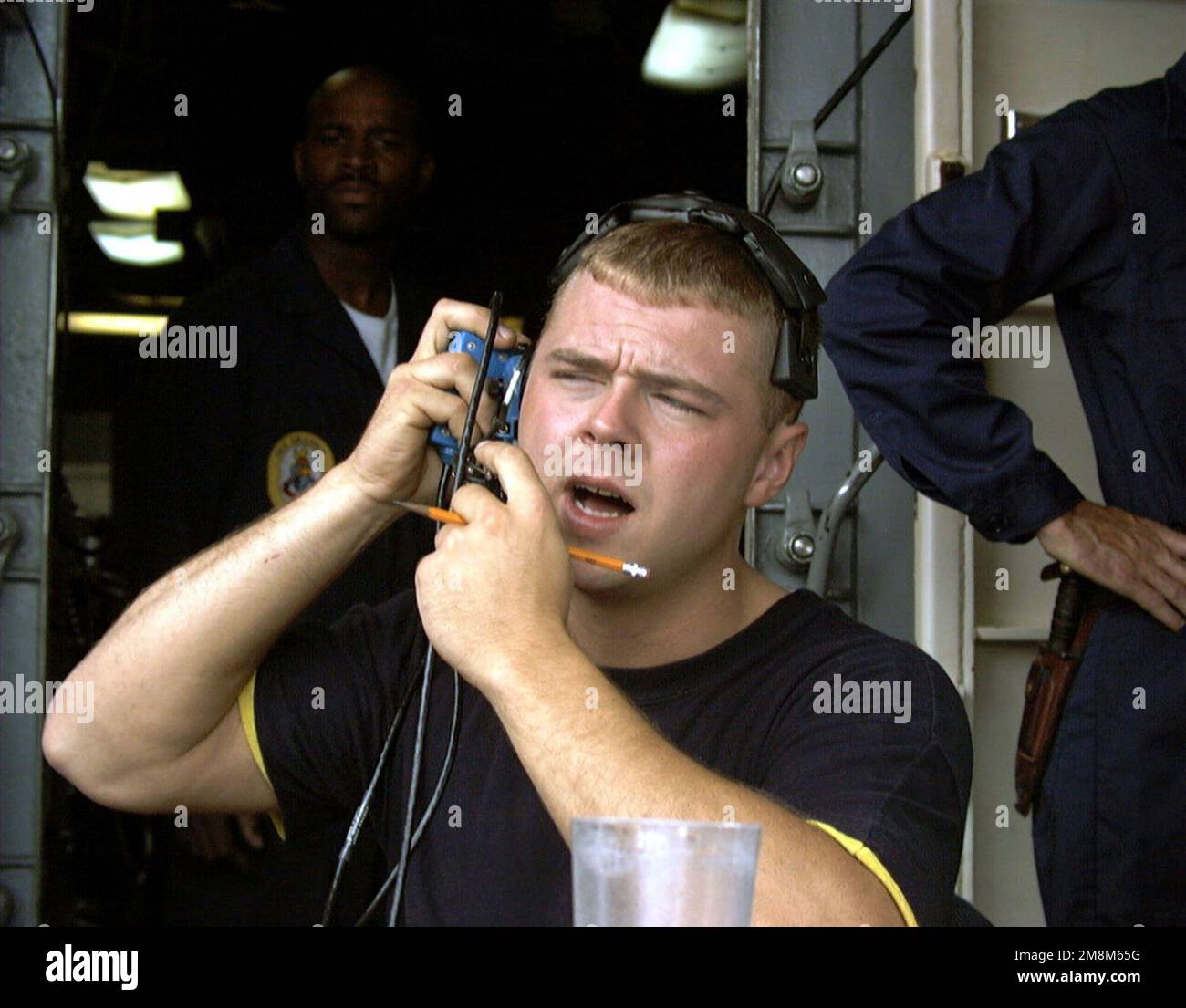 US Navy Boatswains Mate 1ST Class, Diver, Matthew Rotan, talks to ...