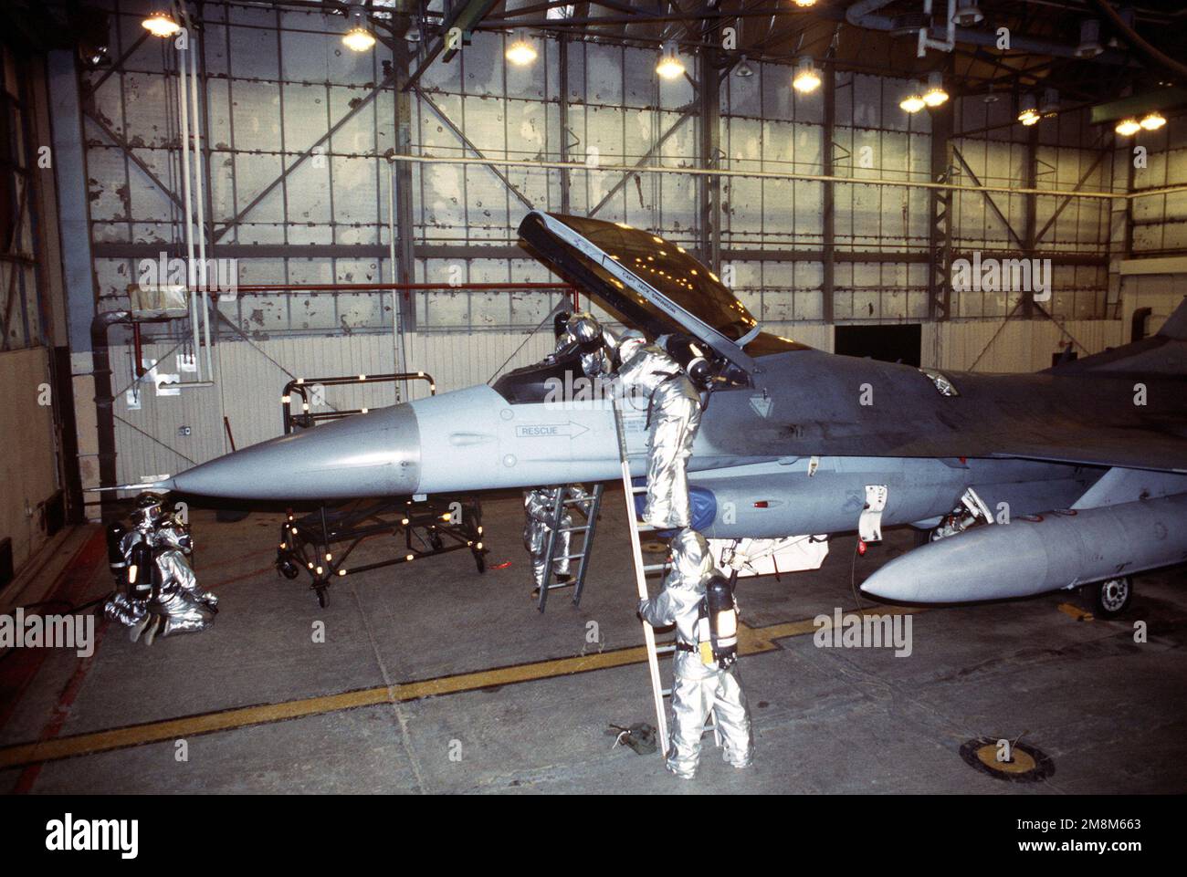 Firefighters from Yokota Air Base, dressed in proximity suits and air ...
