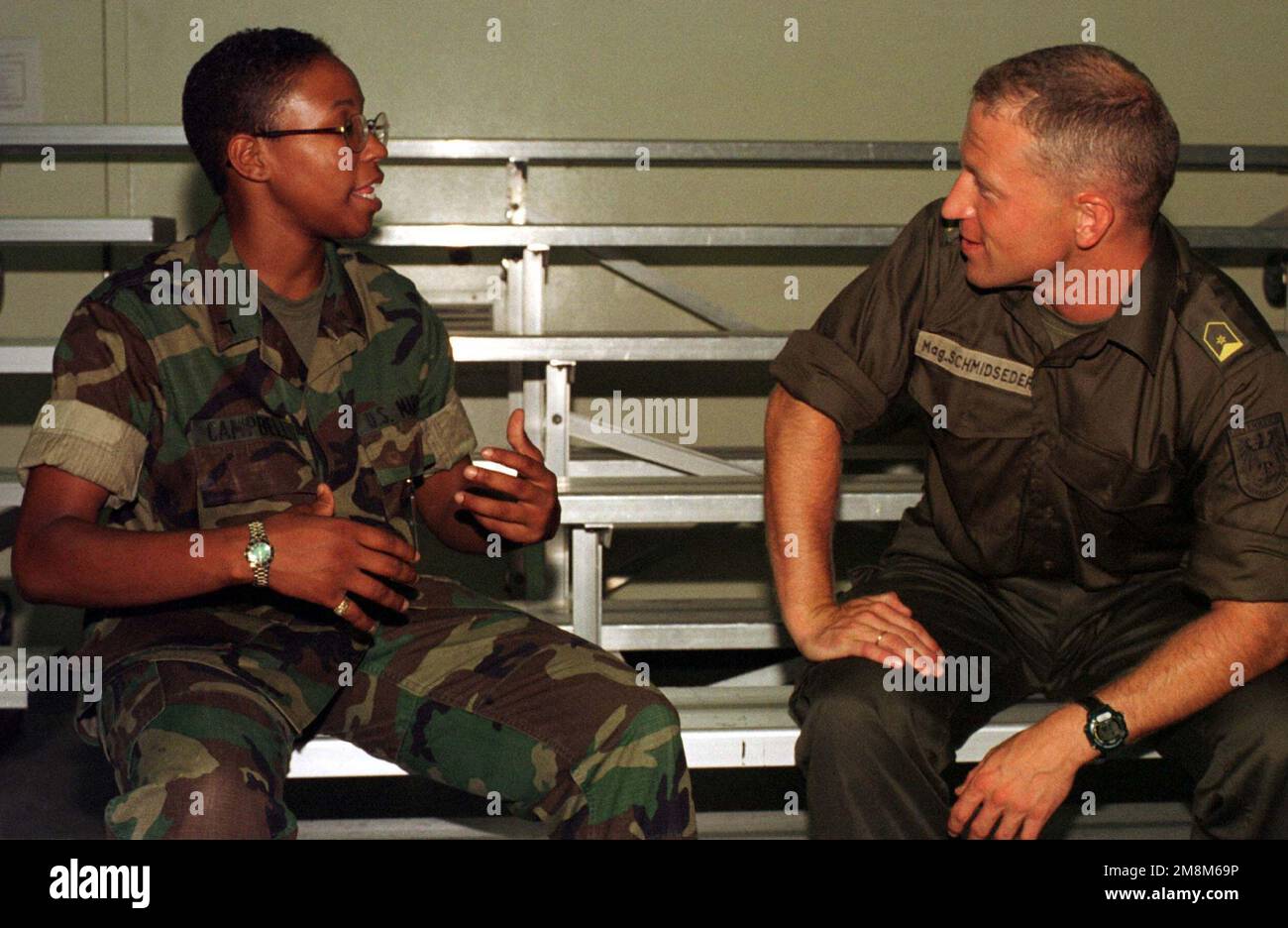 PFC. Campbell, USMC, speaks with MAJ. Schmidseder, Austrian platoon ...