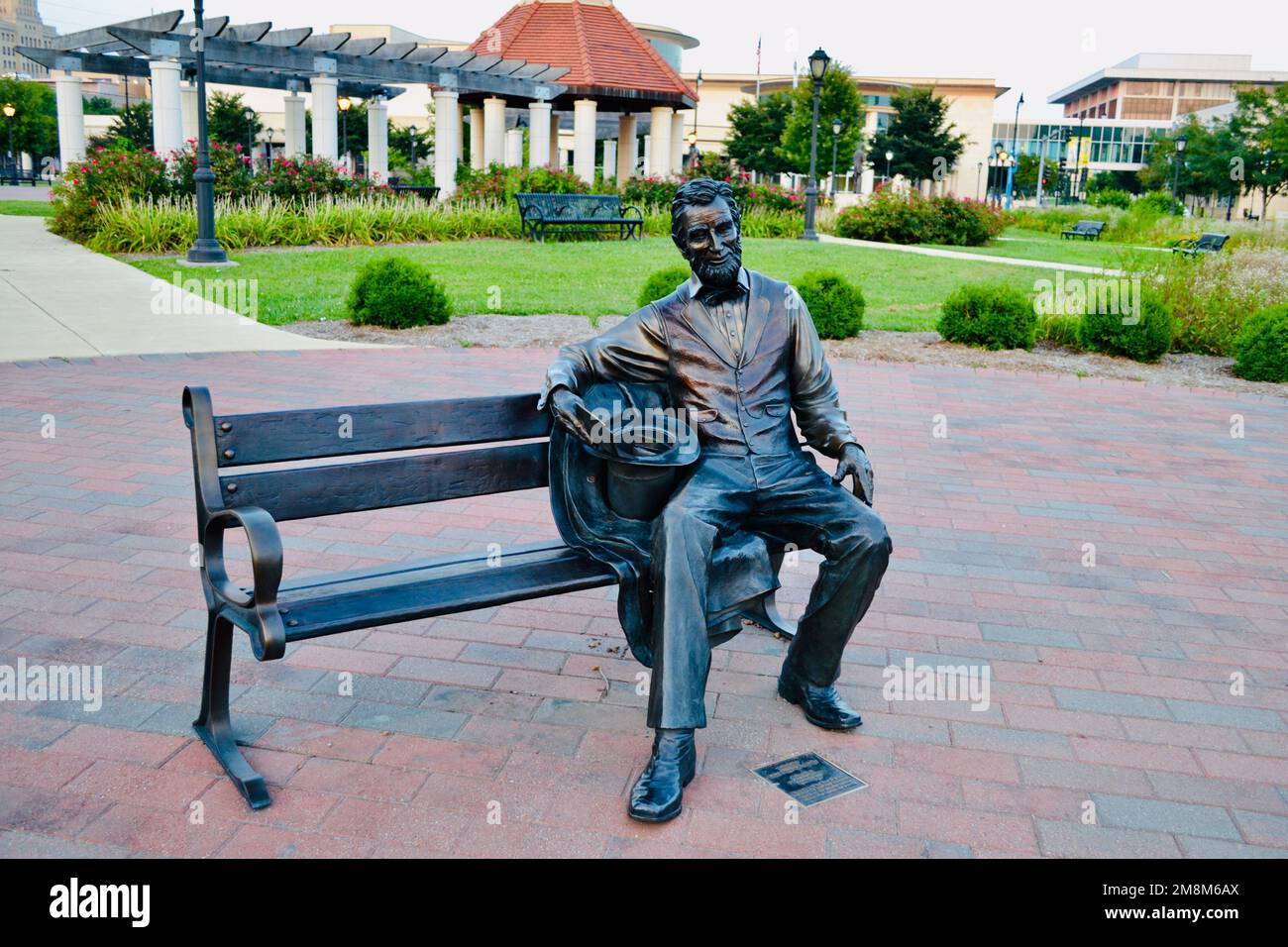 A brass statue of Abraham Lincoln at a city park in Springfield ...