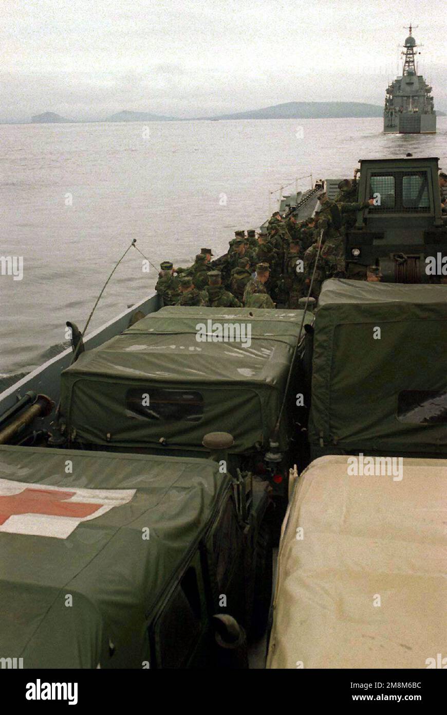 A US Navy Utility Landing Craft (LCU) loaded with medical vehicles and ...