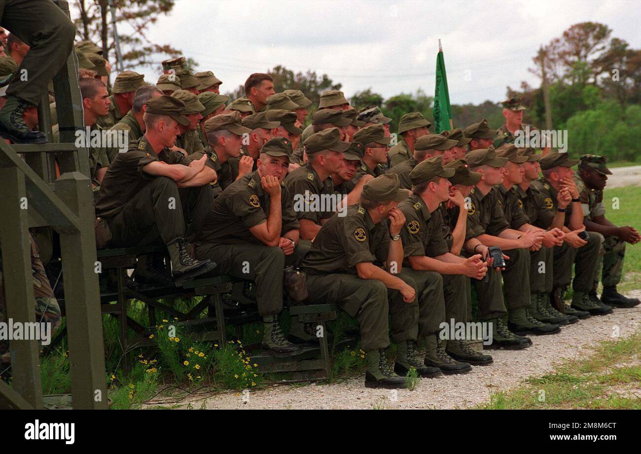 Austrian and Canadian troops listen during an Intelligence brief. Under ...