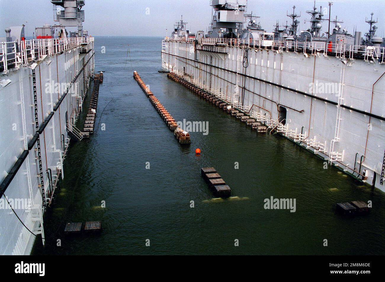 Water begins to rise above the positioning blocks on board the US Navy ...