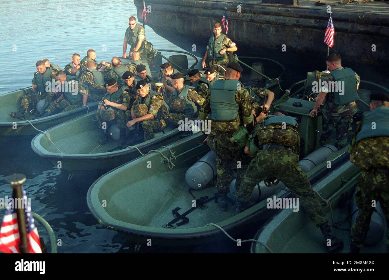 Ukrainian Marines load up on Rigid Raiders in preparation for movement ...
