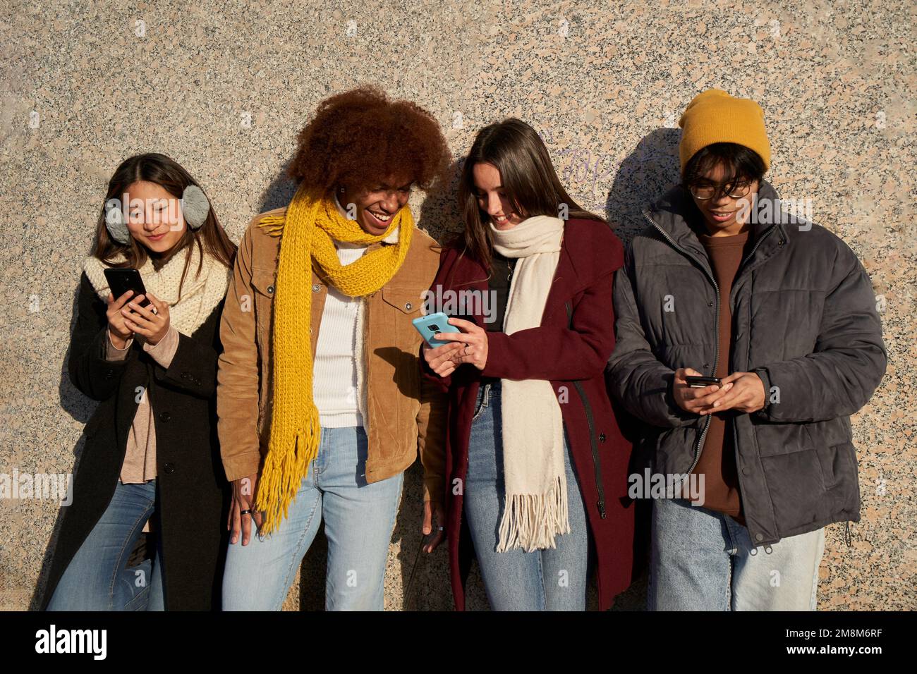 Group of young people using smart mobile phones app. Teenagers addicted ...