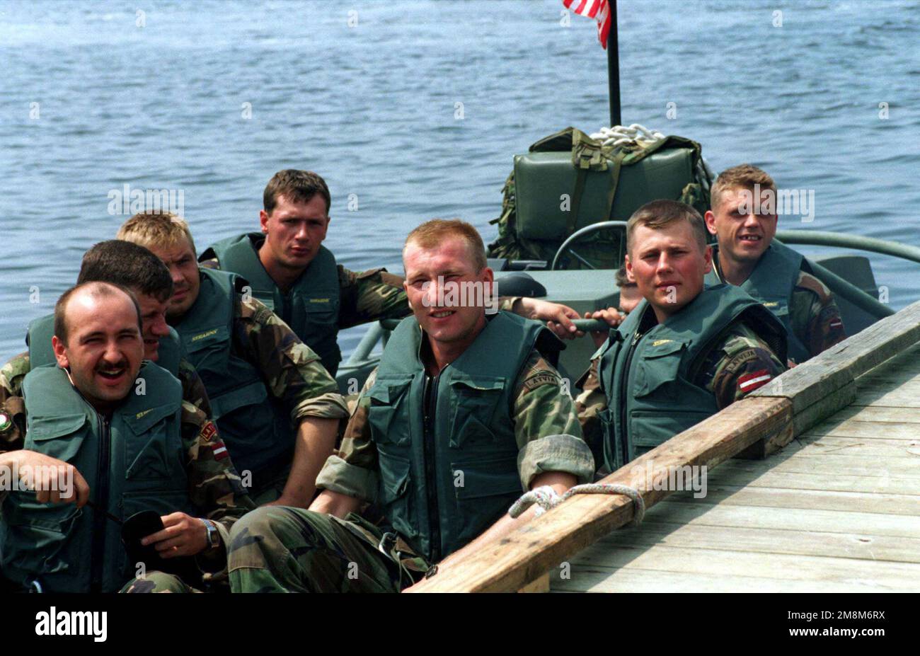 Latvian Soldiers pose for a photo aboard Rigid Raider craft during ...