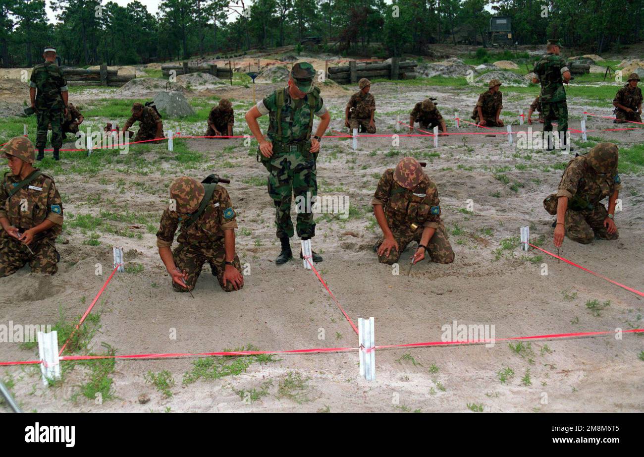 US Marine Corps instructors watch as Kazakhstan Soldiers, probe for ...