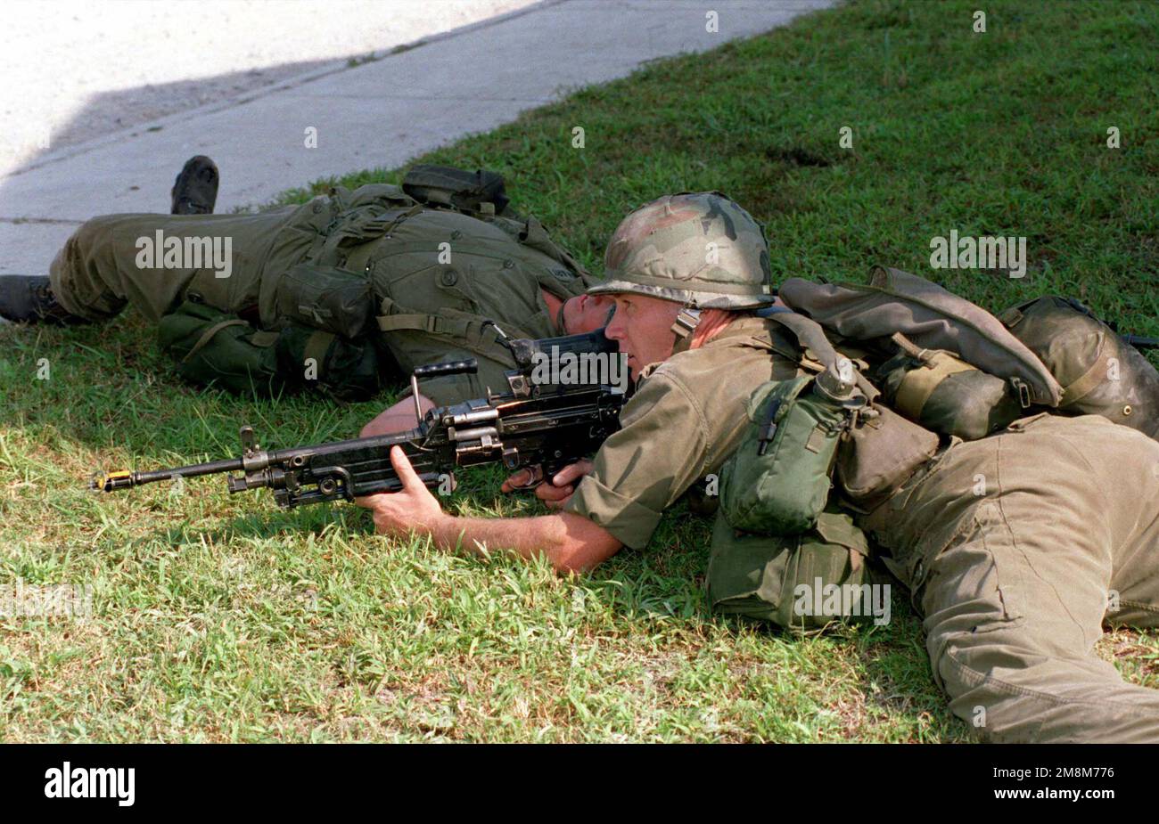 A Canadian soldier armed with an M249 squad automatic weapon provides ...