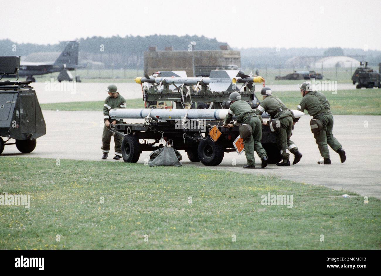 Members of the 48th Equipment Maintenance Squadron transport missiles ...