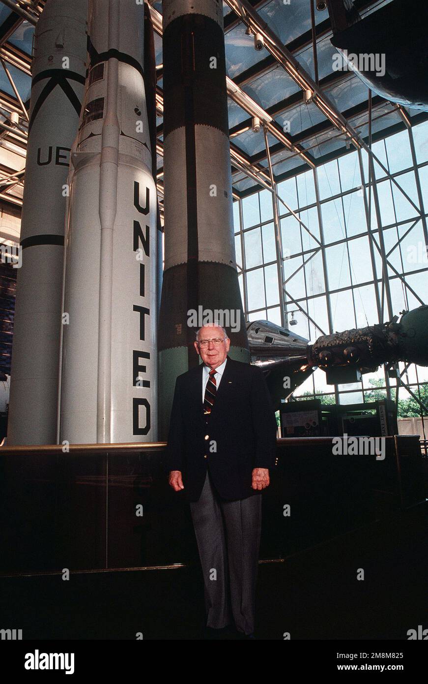 GEN. Russell E. Dougherty (retired) poses beside a missile at the ...