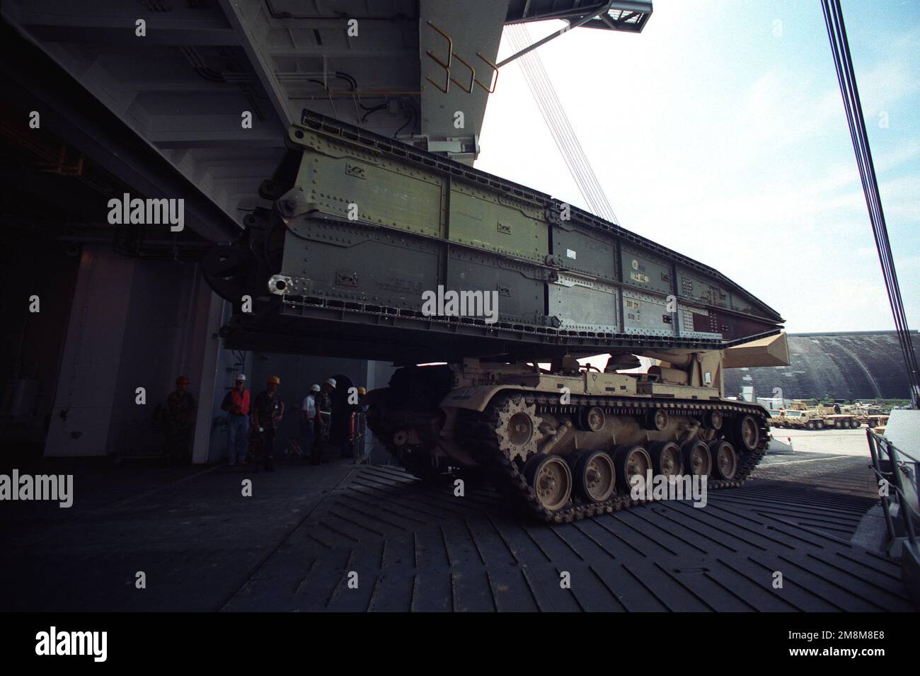 A Heavy Assault Bridge (HAB) launcher rolls up the loading ramp of the ...