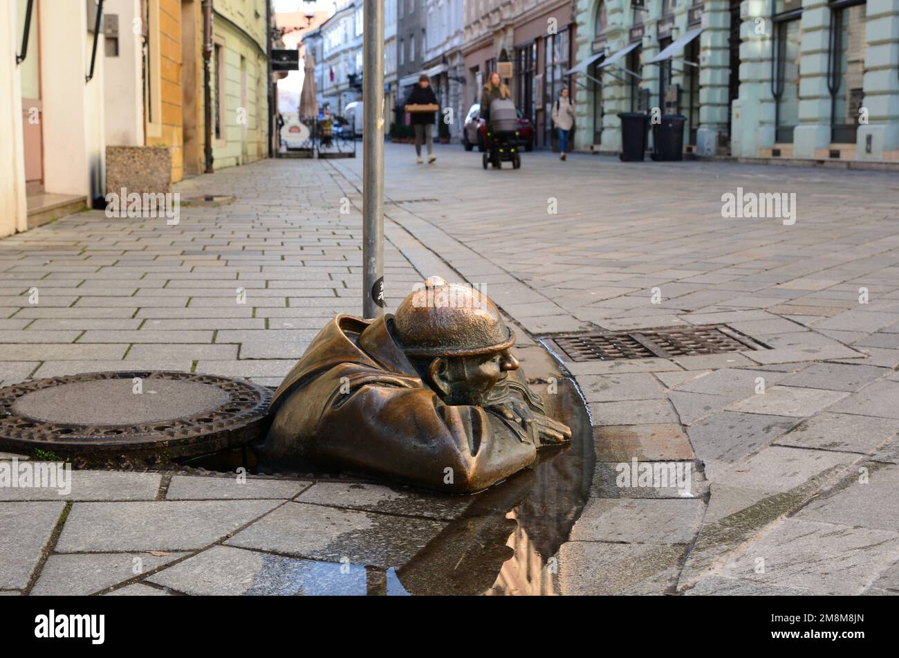 Statue of Cumil the sewer worker. Bratislava. Slovakia Stock Photo - Alamy