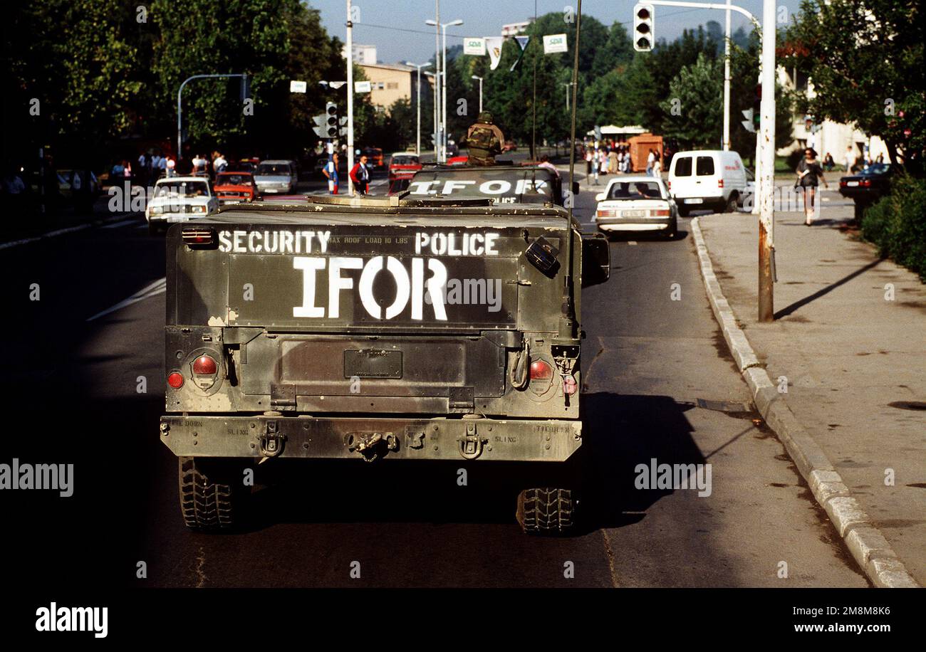 Two High-Mobility Multipurpose Wheeled Vehicles (HMMWV) in a convoy ...