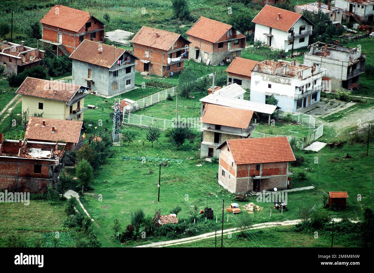 An aerial close-up view of some of the houses damaged during the war in ...