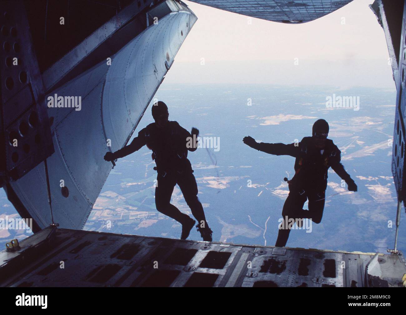 Two members of the U.S. Army parachute team, Golden Knights, jump from ...