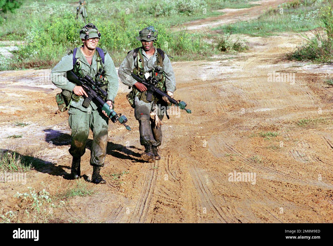 Opposing Forces (OPFOR) soldiers armed with M16 rifles, equipped with ...