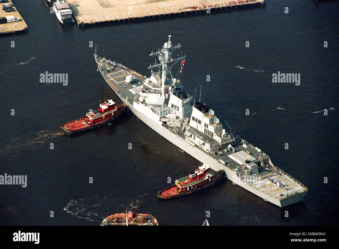 An aerial port quarter view of the guided missile destroyer USS ...