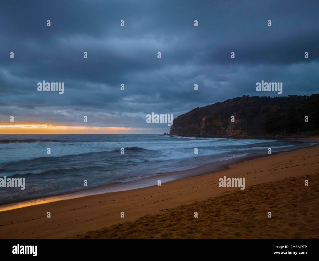 Aerial sunrise with cloud filled sky and waves at Macmasters Beach on ...