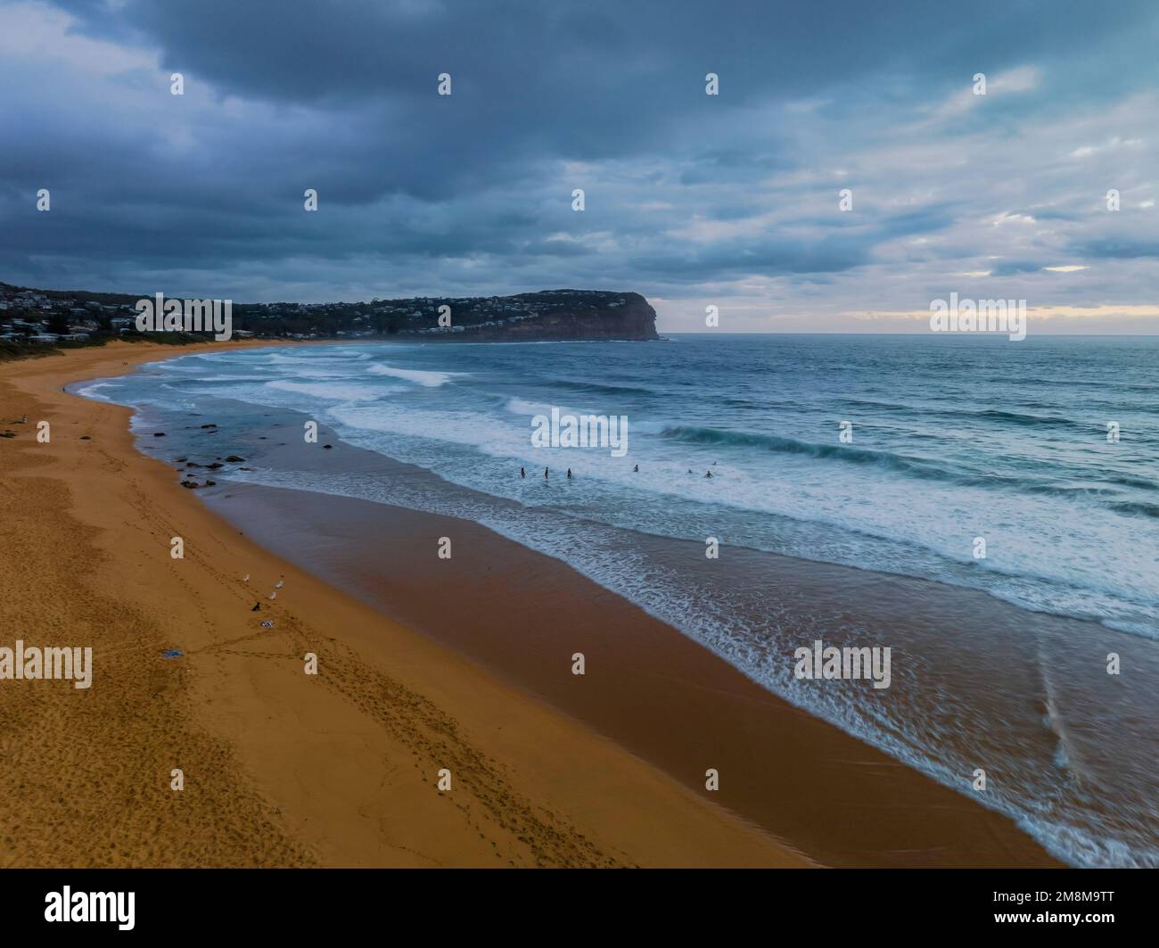 Aerial sunrise with cloud filled sky and waves at Macmasters Beach on ...