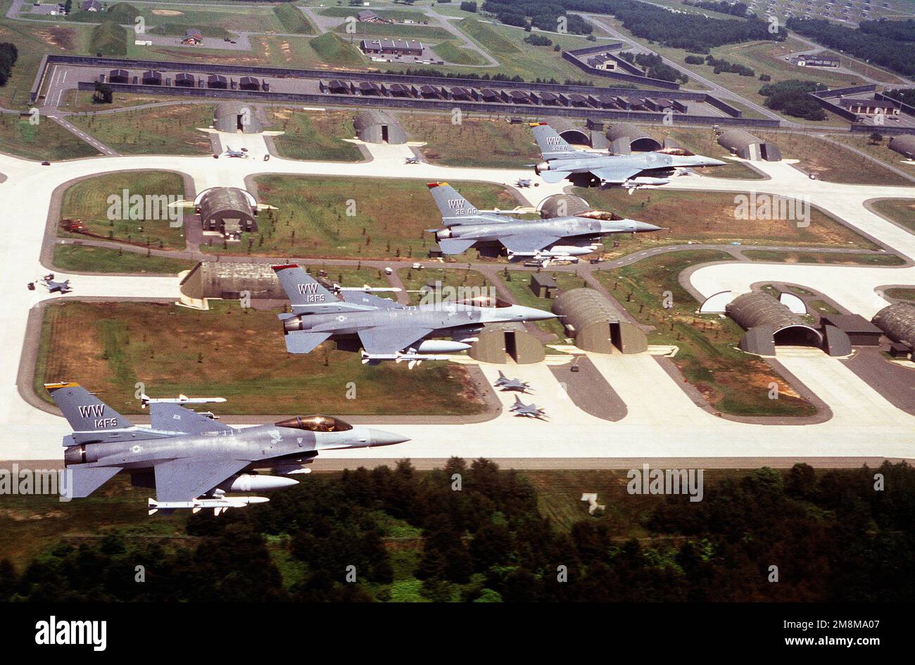 A four ship formation of 35th Fighter Wing F-16Cs Wild Weasels fly over ...